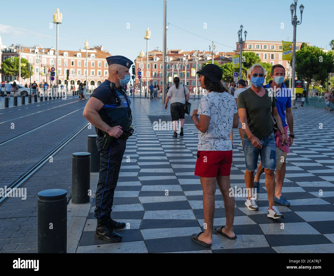 Paris, France. 4th Aug, 2020. A policeman patrols to inform people to ...