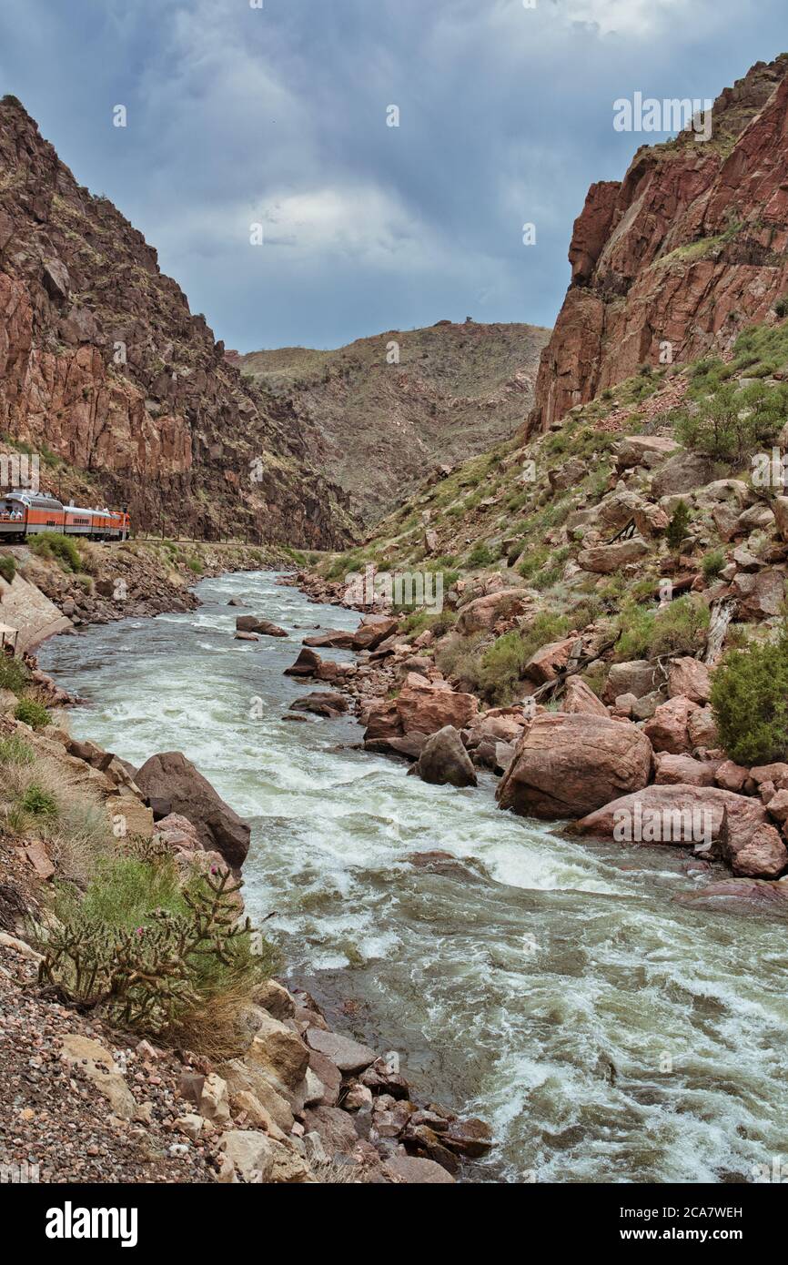 Ravine with train and river in Colorado Stock Photo - Alamy