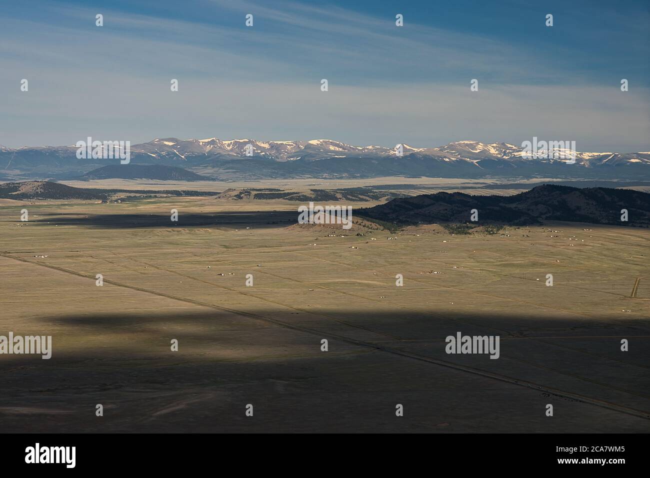 Rocky mountains in the distance of colorado plane painted by sunlight ...