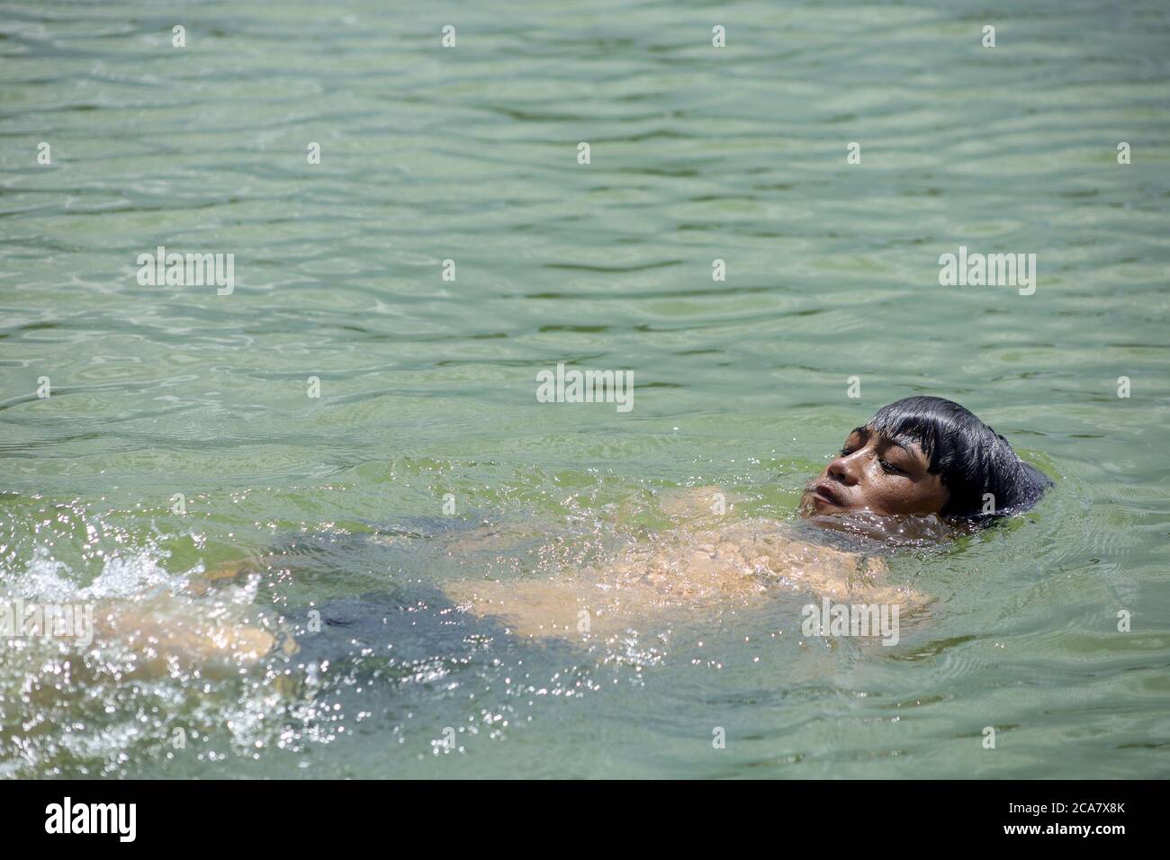 Bhaktapur, Nepal. 04th Aug, 2020. A Nepalese kid swim in a water pond ...