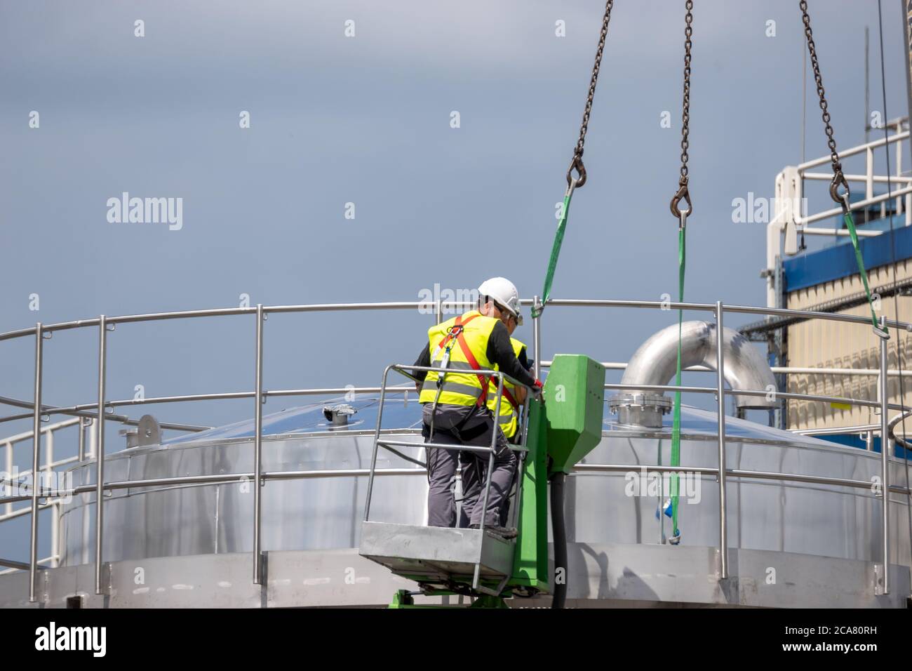 Fitters work on the lift Stock Photo - Alamy