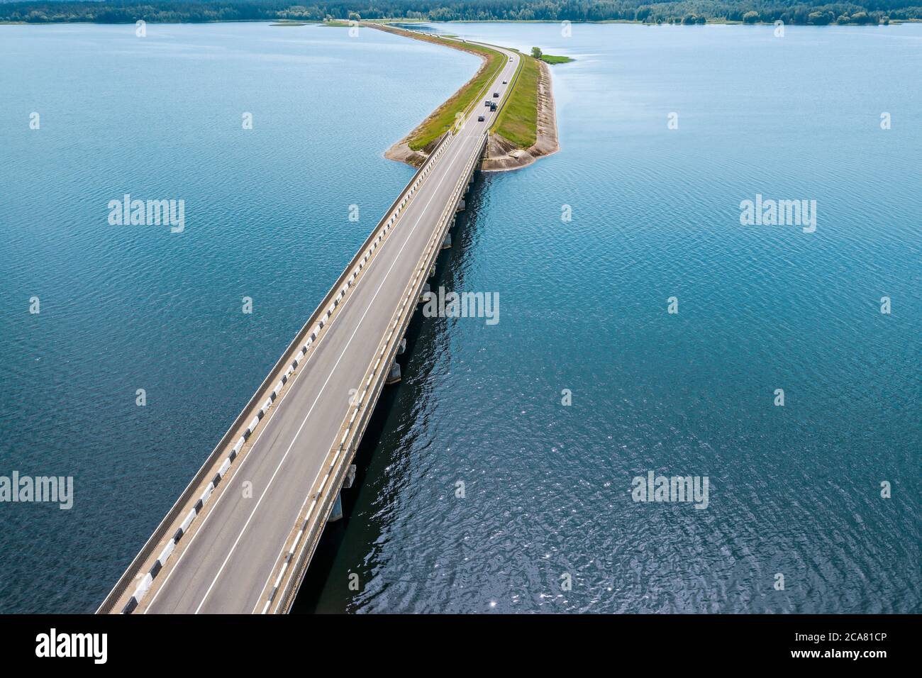 aerial view of bridge across blue lake in summer landscape. Belarus ...