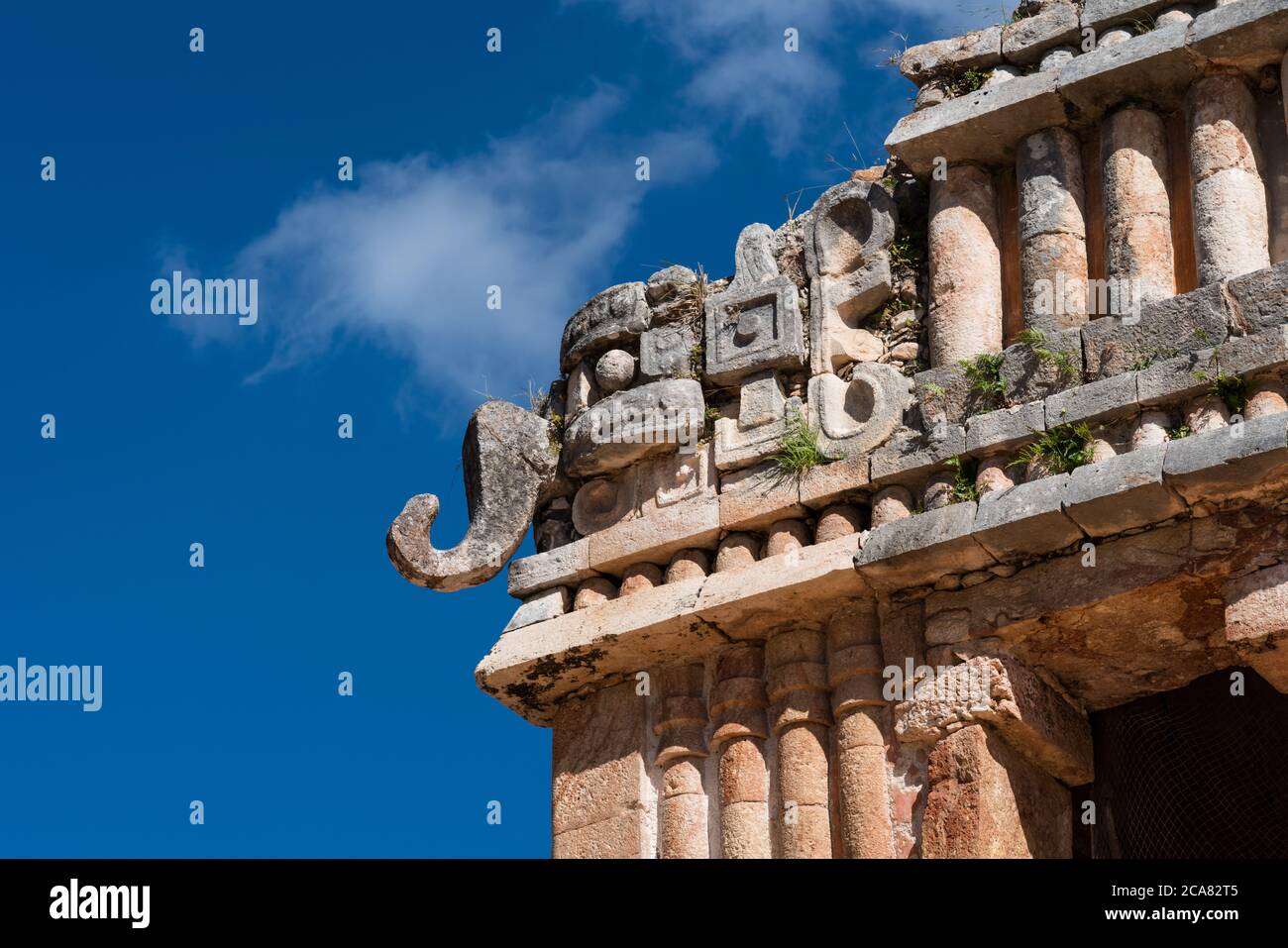 A Chaac mask on the Grand Palace in the ruins of the Mayan city of ...