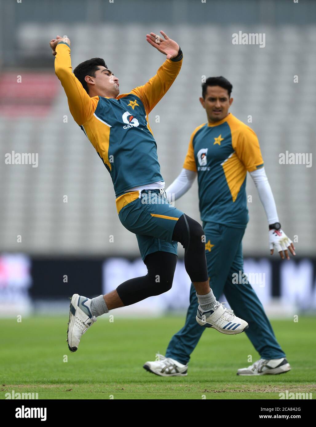 Nasim Shah of Pakistan bowls watched on by Mohammad Abbas during a nets ...