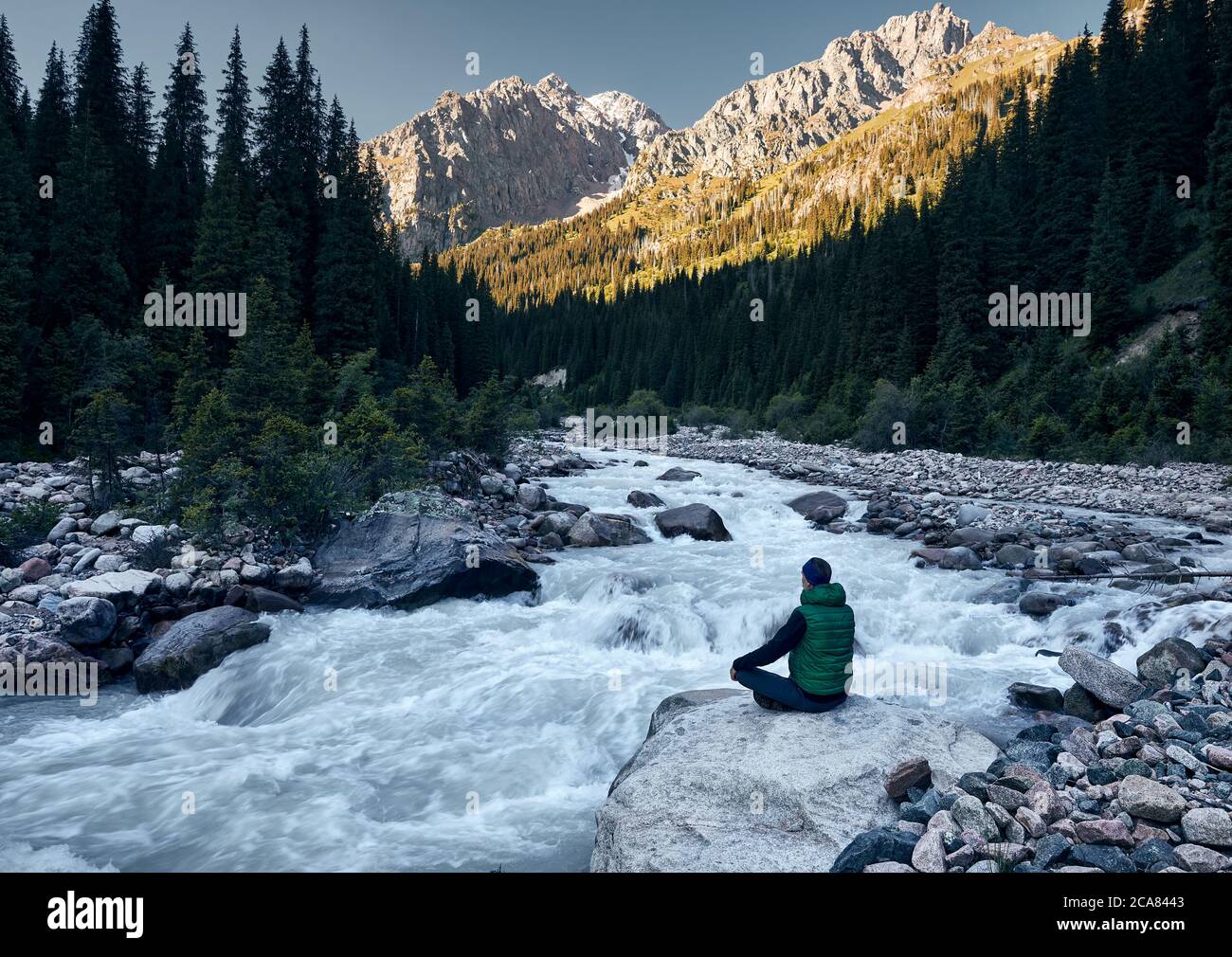Man sitting on top mountain hi-res stock photography and images - Alamy