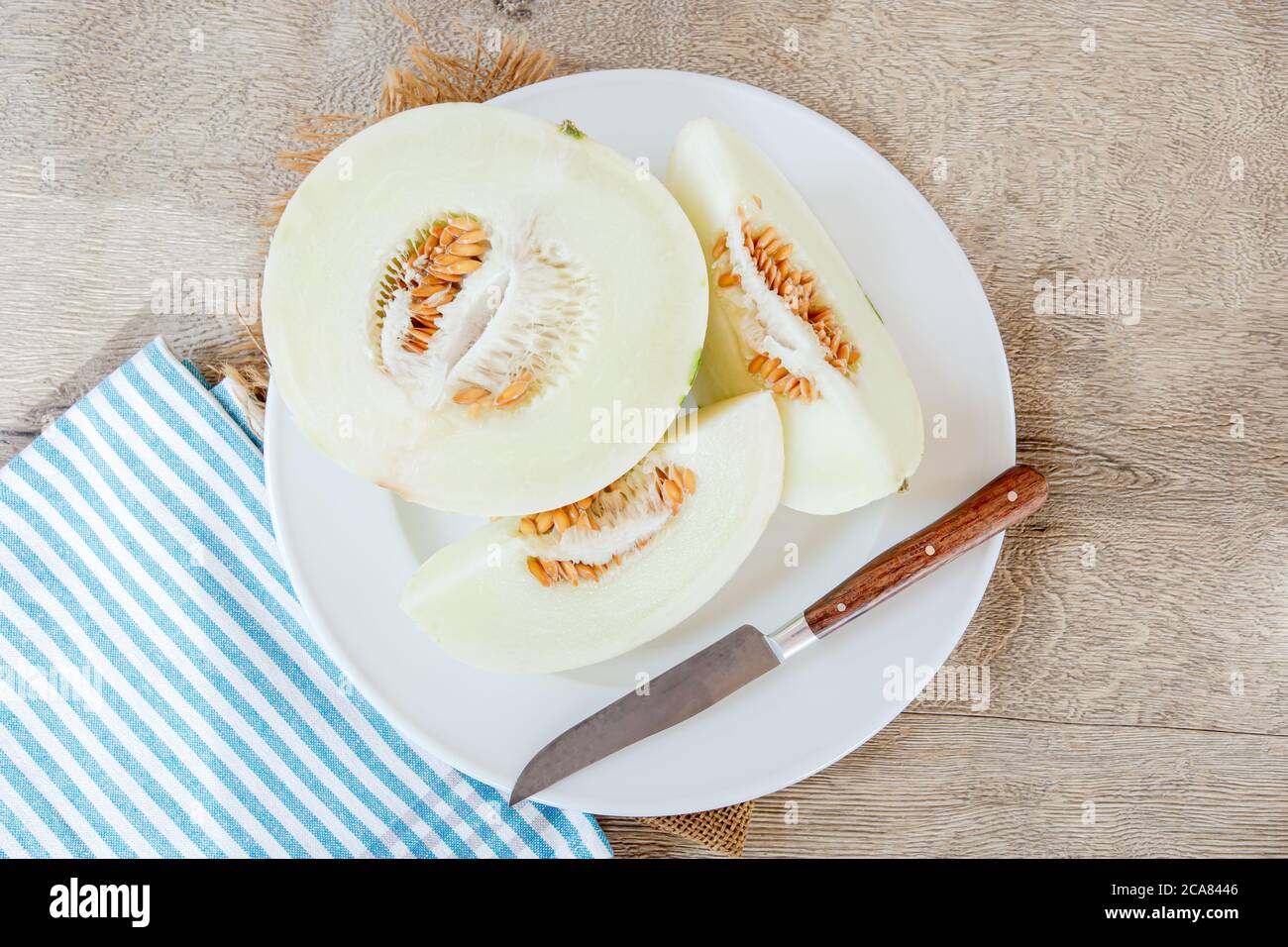 white melon cut in a plate Stock Photo - Alamy