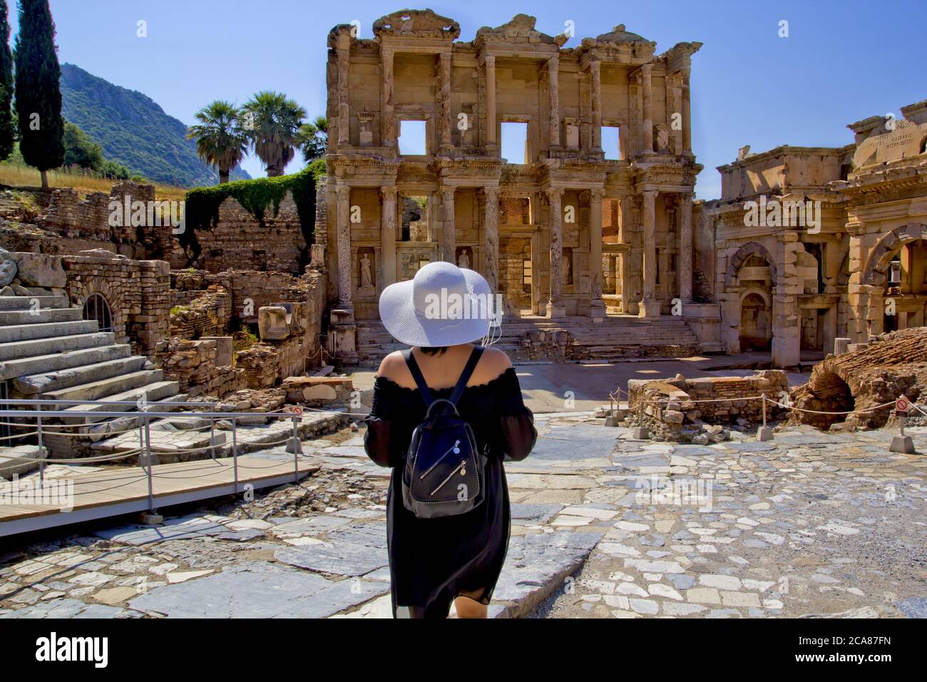Beautiful young woman in black dress in Ephesus ancient city Stock ...