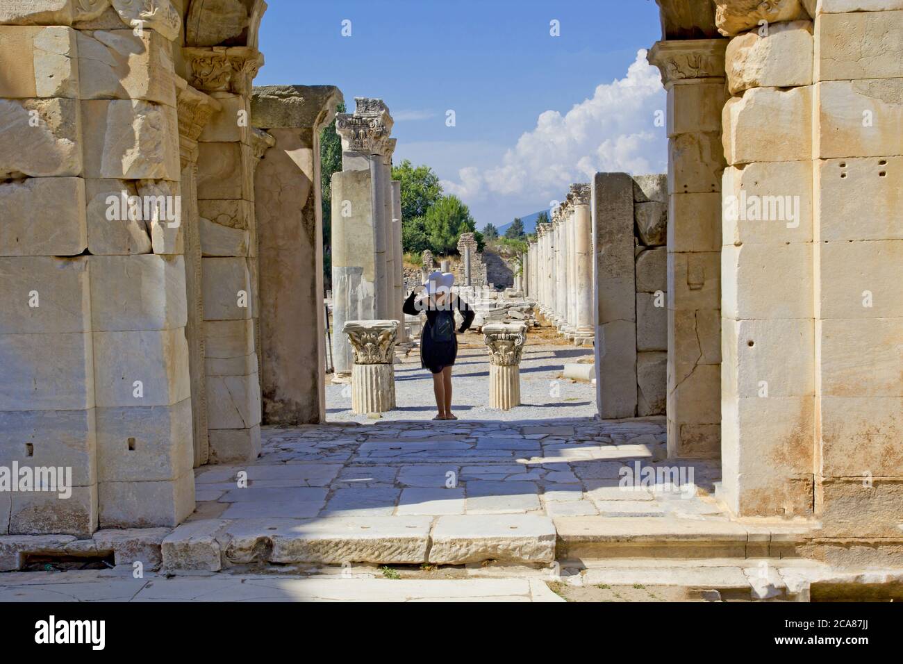 Beautiful young woman in black dress in Ephesus ancient city Stock ...