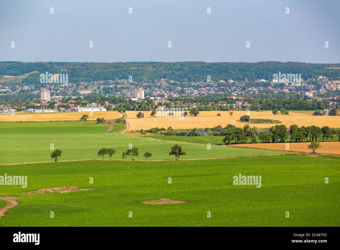 View to a city in the countryside with fields Stock Photo - Alamy