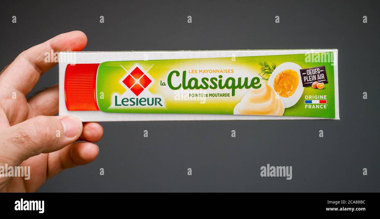 Paris, France - May 29, 2020: Man hand holding against gray background ...