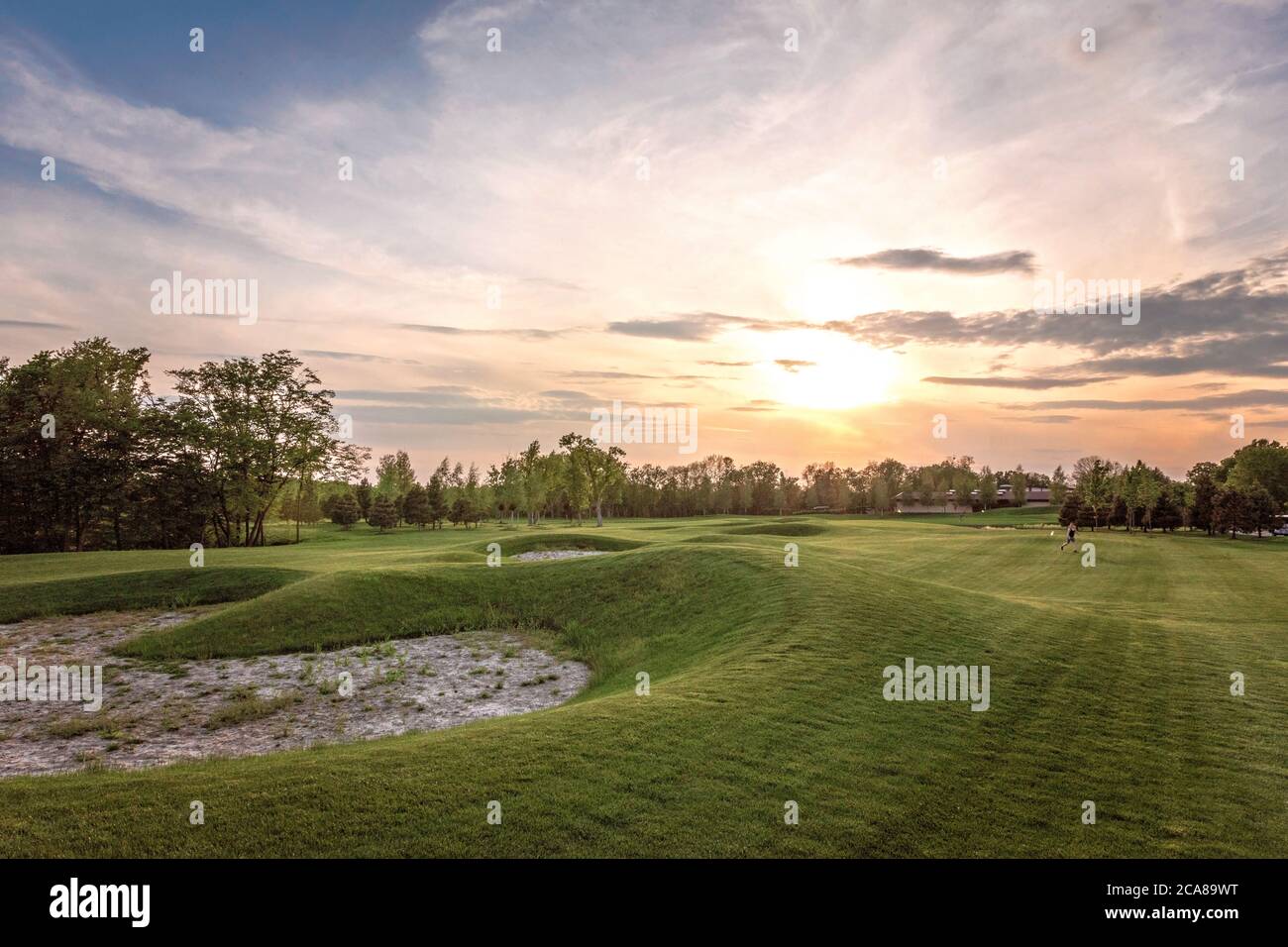 Golf Course at Sunset Stock Photo - Alamy