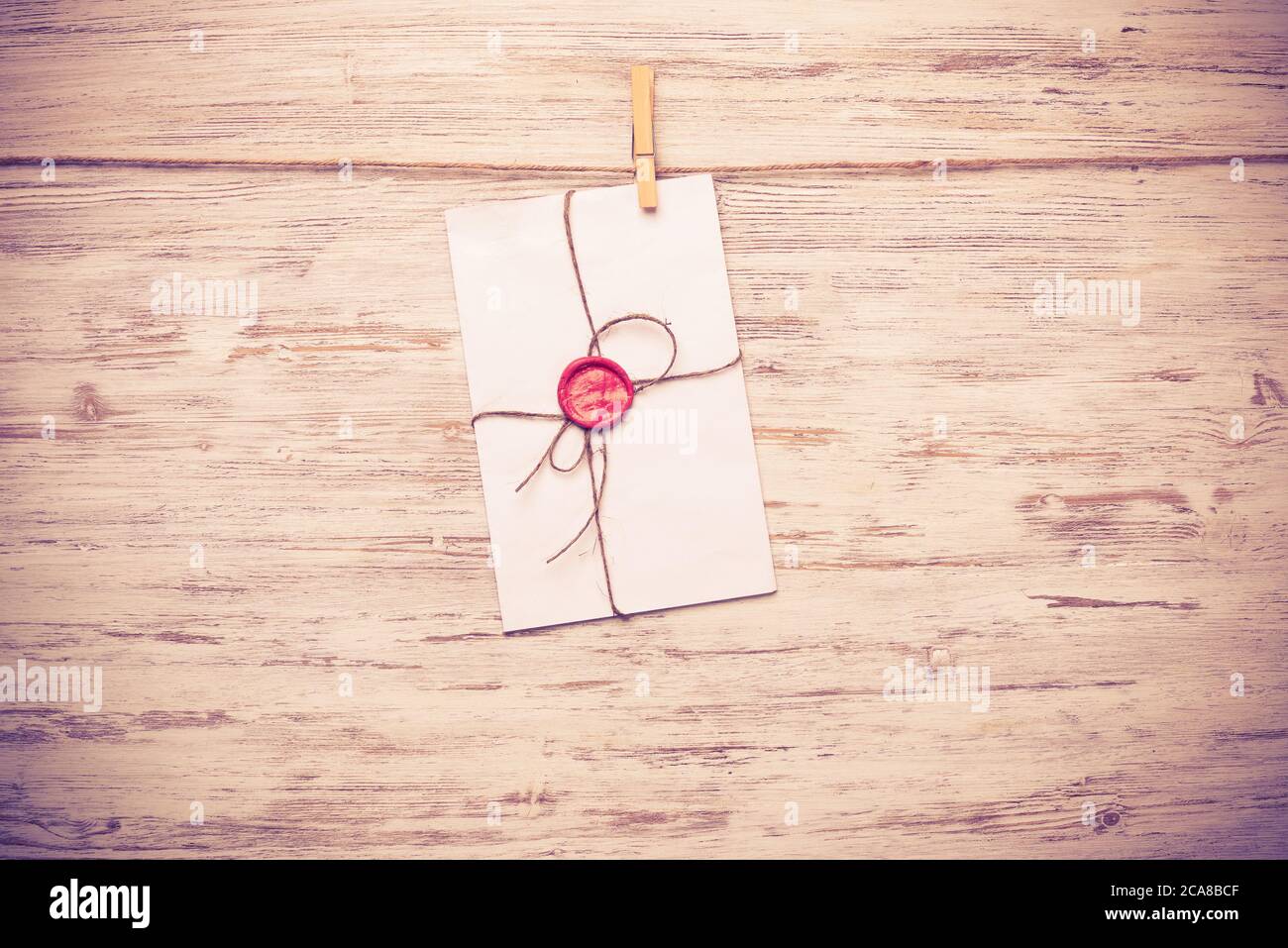 Mail envelope on rope Stock Photo - Alamy