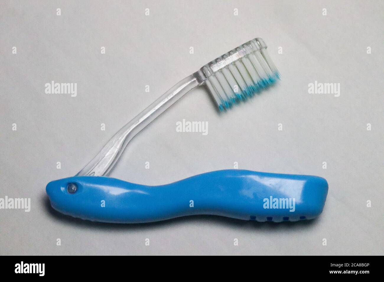 blue folding toothbrush isolated white background Stock Photo - Alamy