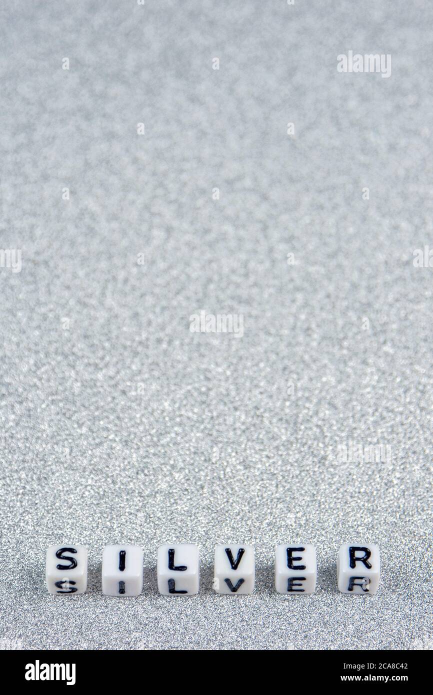 silver word formed by white dices with black letters laying in bottom ...