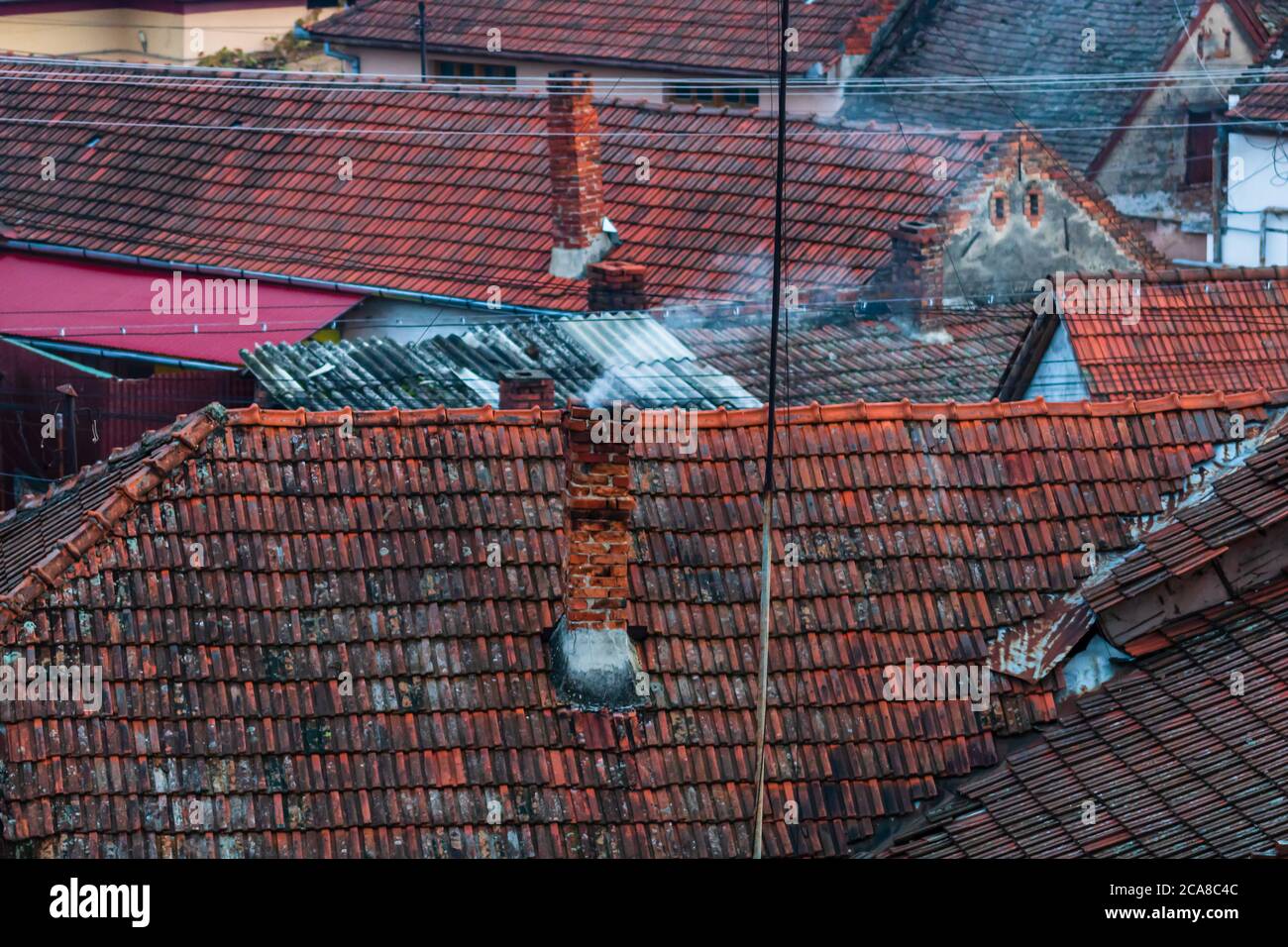 Overview of tile rooftops of old houses. Old buildings architecture ...