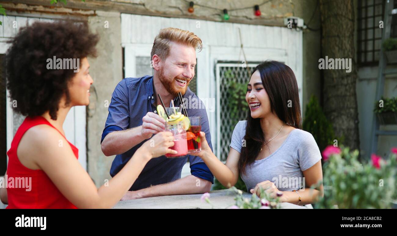 Group of friends having fun together. People talking laughing and ...