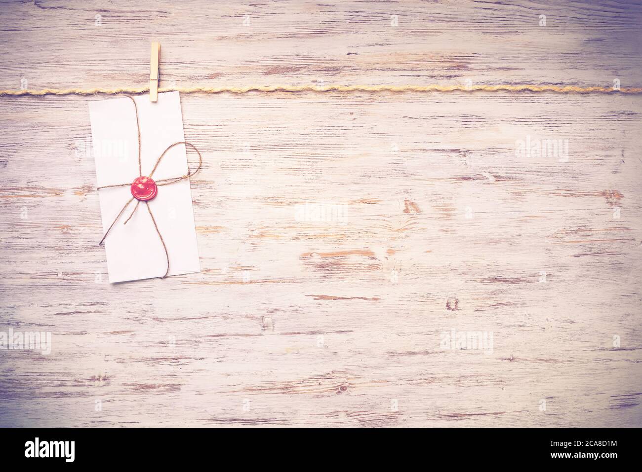 Mail envelope on rope Stock Photo - Alamy