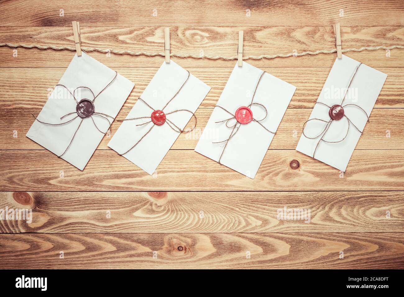 Mail envelope on rope Stock Photo - Alamy
