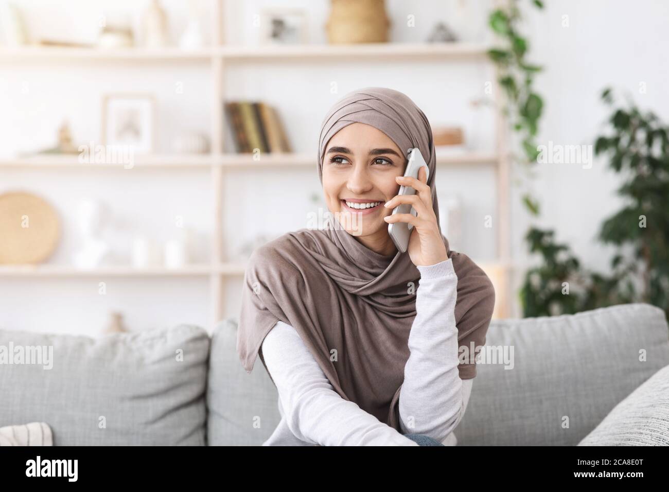 Long-Awaited Call. Happy Muslim Girl In Hijab Having Phone Conversation ...