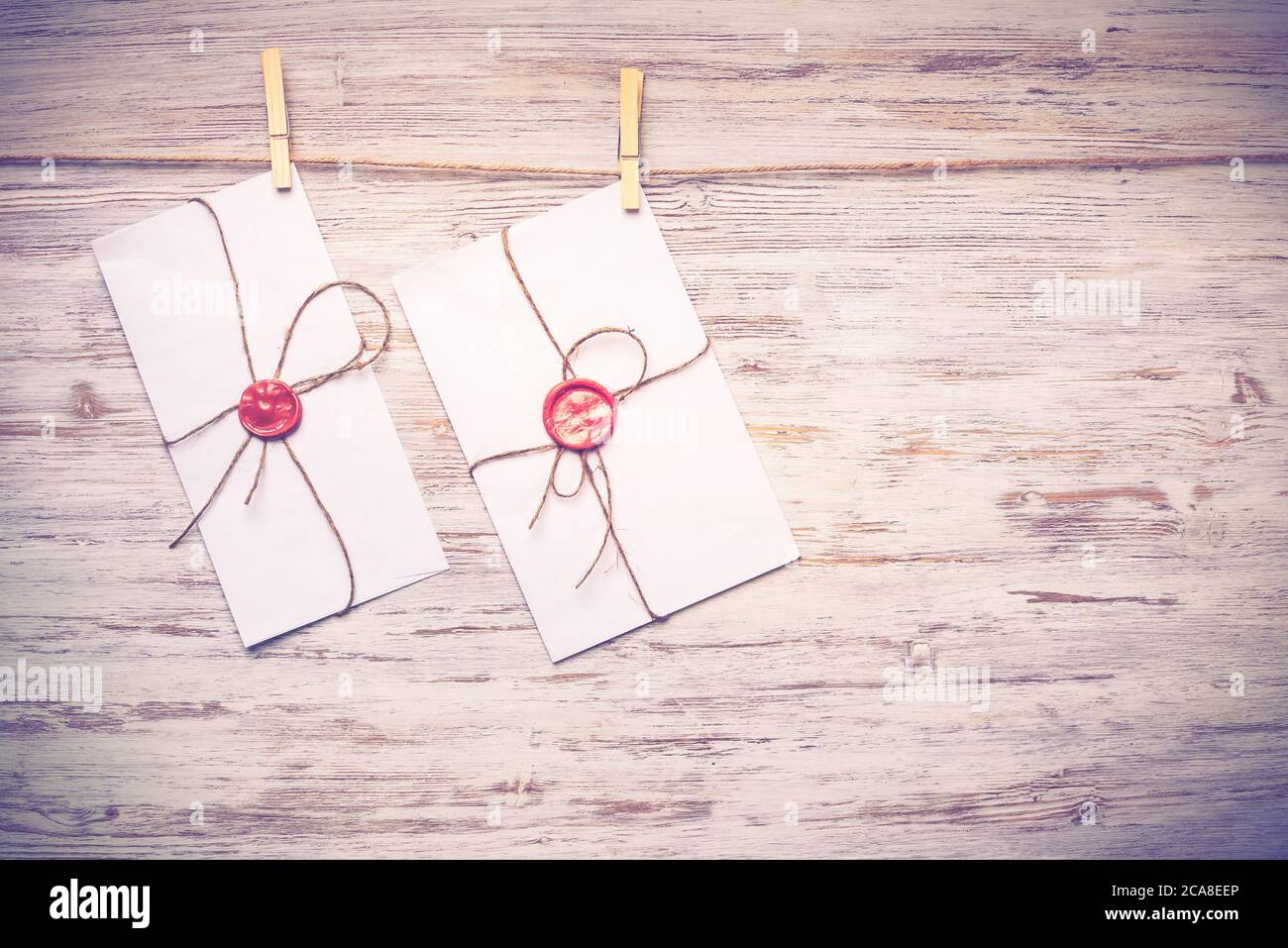 Mail envelope on rope Stock Photo - Alamy