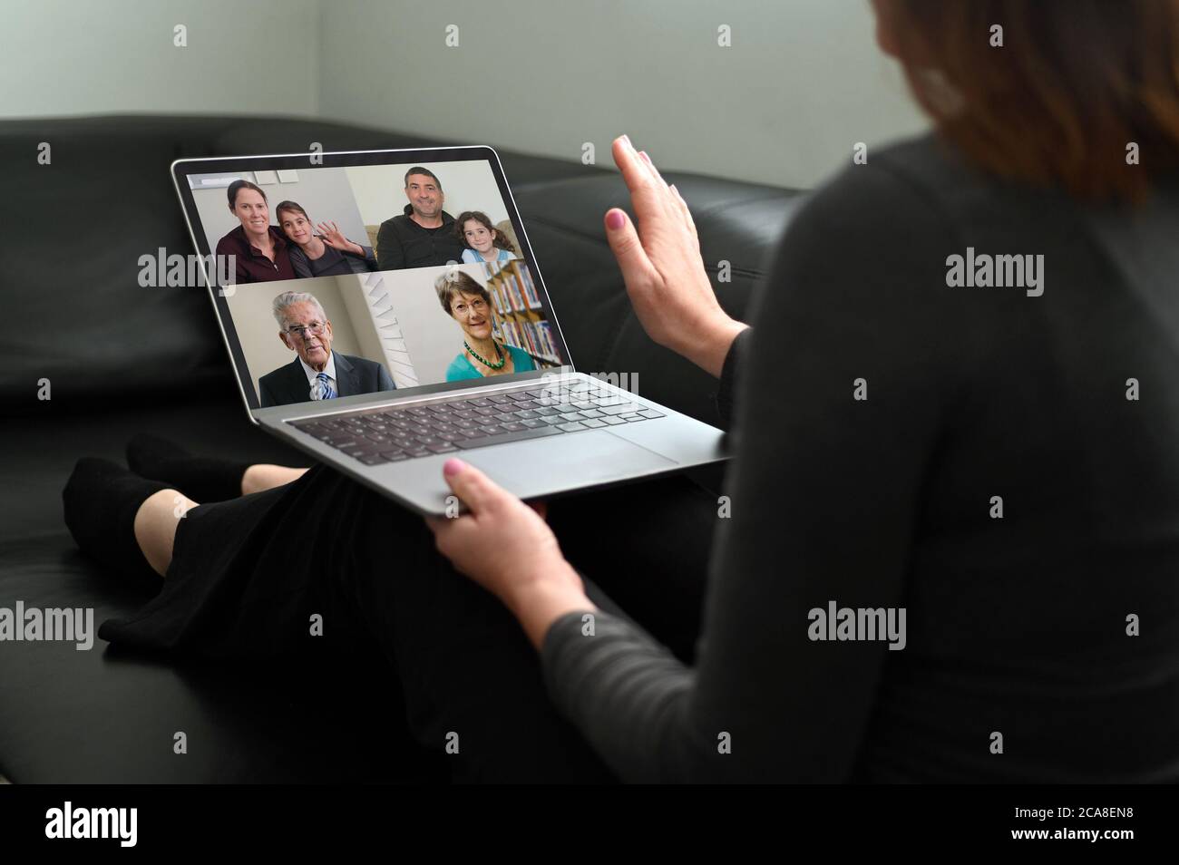 Family Members Sitting On Couch High Resolution Stock Photography and ...