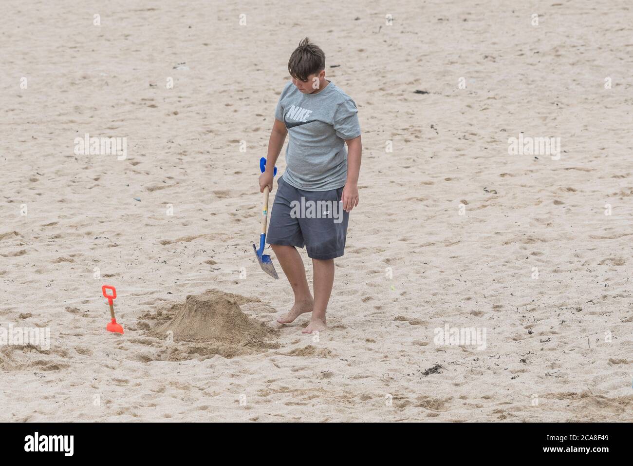 Boy building sandcastle on beach hi-res stock photography and images ...