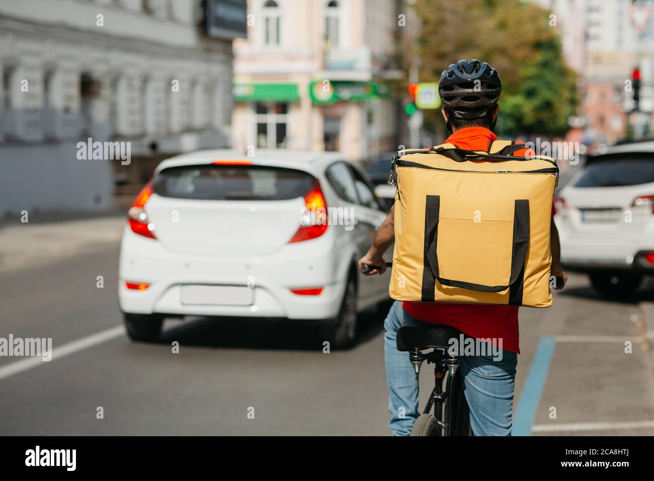 Delivery courier rides bicycle hi-res stock photography and images - Alamy