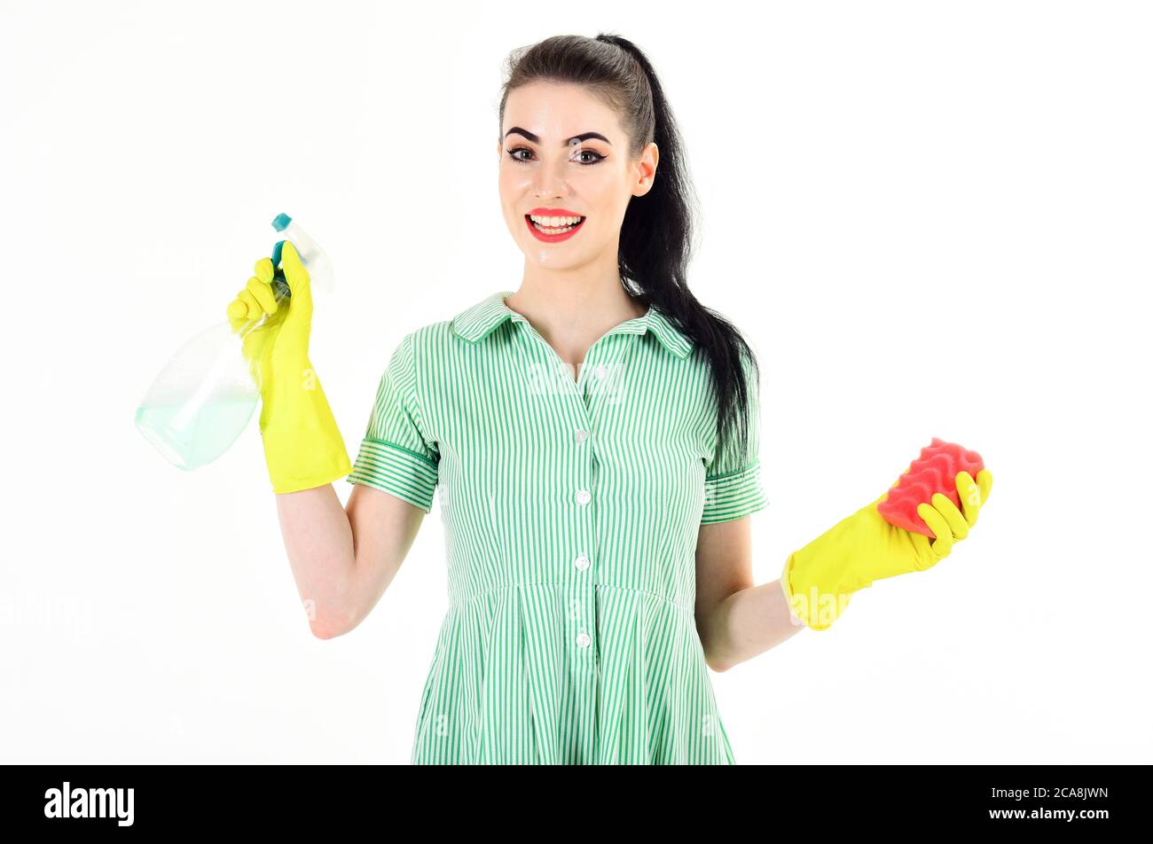 Housewife with cheerful face, make up and cleaning supplies. Woman ...