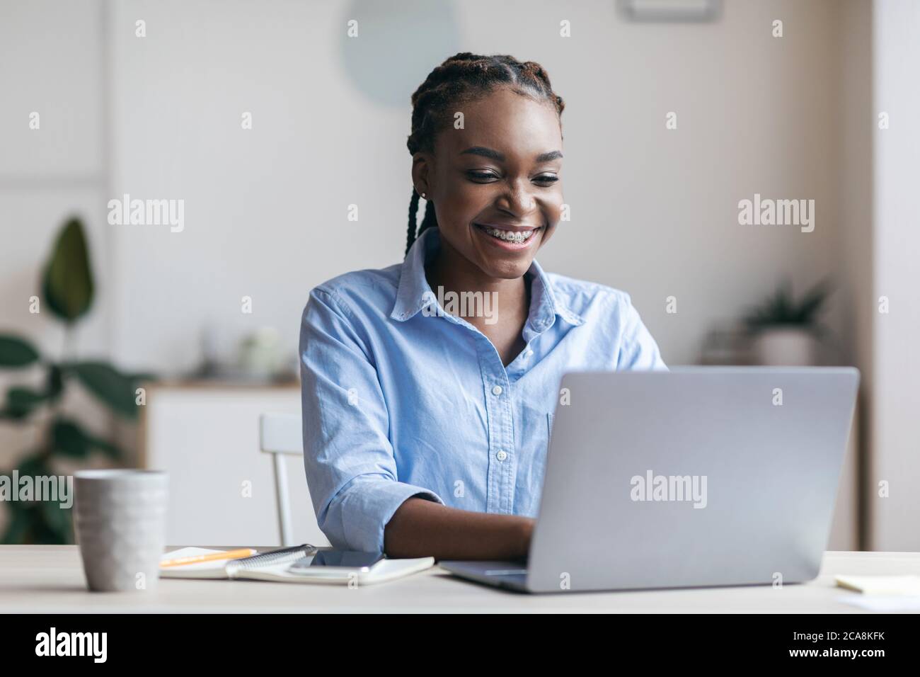 Young Black Secretary Working On Laptop In Modern Office, Typing On ...