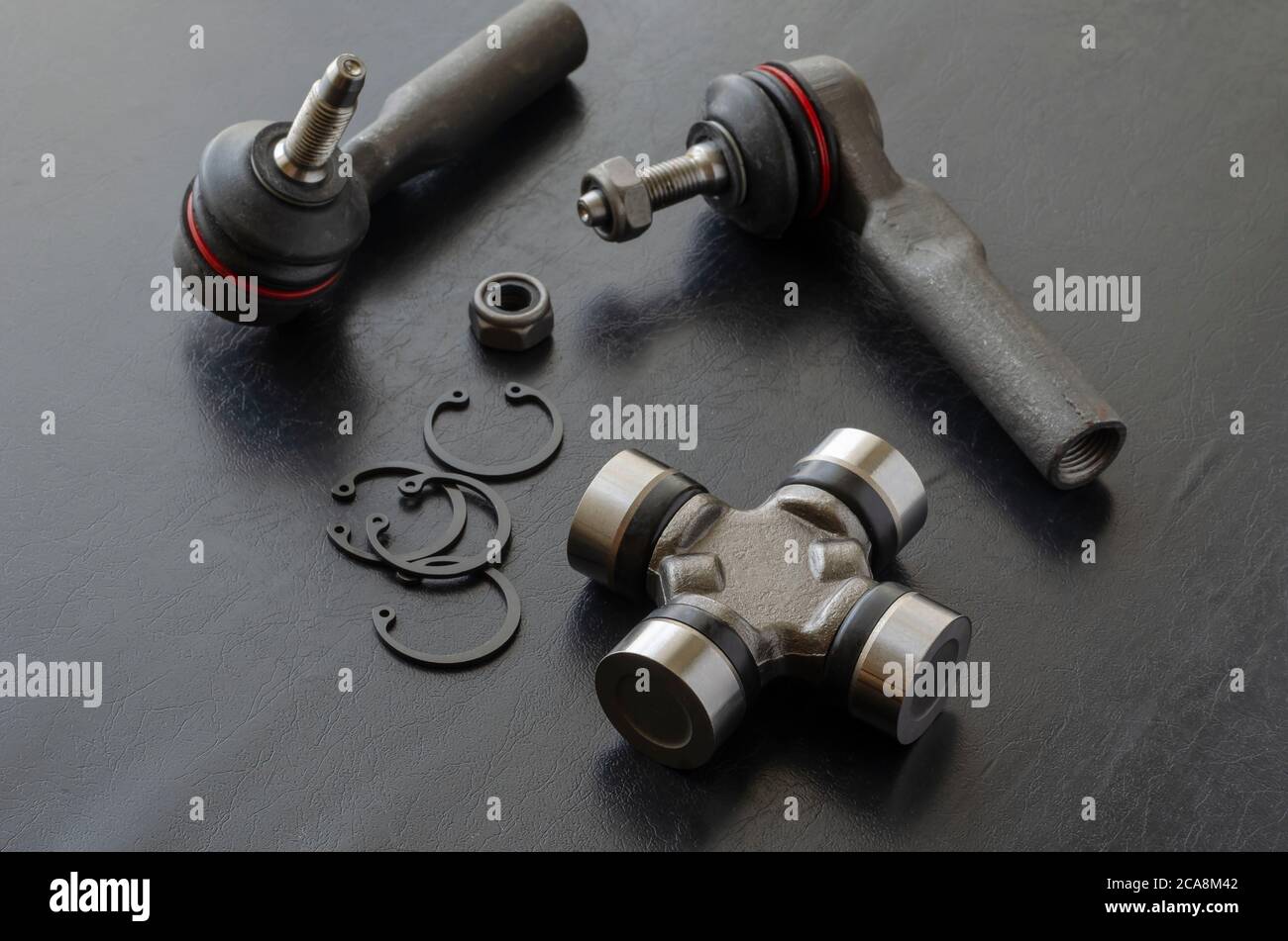 Cross joint of the propeller shaft and a set of tie rod ends. New auto ...