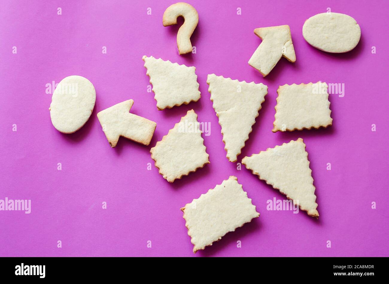 Creative background Homemade shortbread cookies. Arrow symbol, question ...