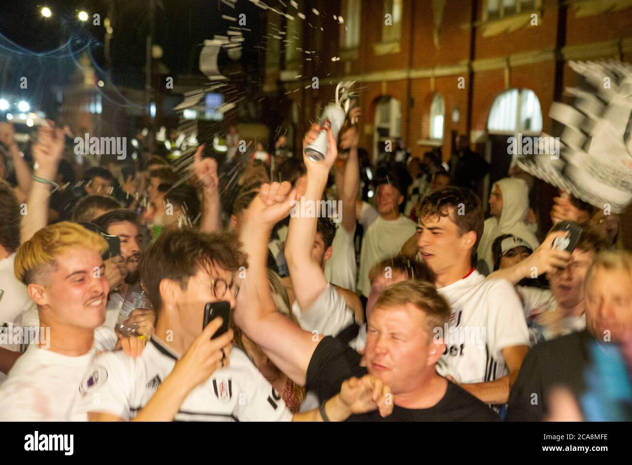 Fulham F.C. fans celebrate their team beating local rivals Brentford F ...
