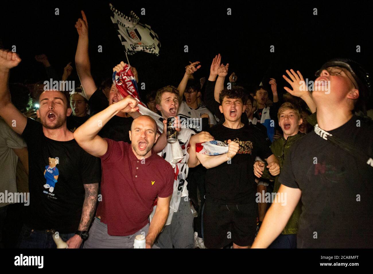 Fulham F.C. fans celebrate their team beating local rivals Brentford F ...