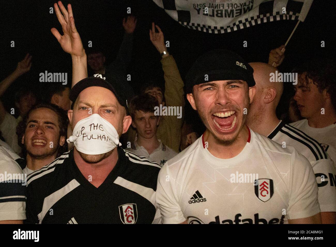 Fulham F.C. fans celebrate their team beating local rivals Brentford F ...
