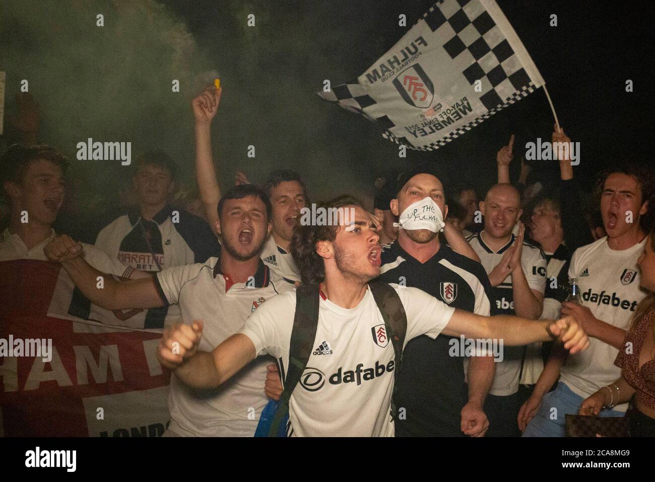 Fulham F.C. fans celebrate their team beating local rivals Brentford F ...