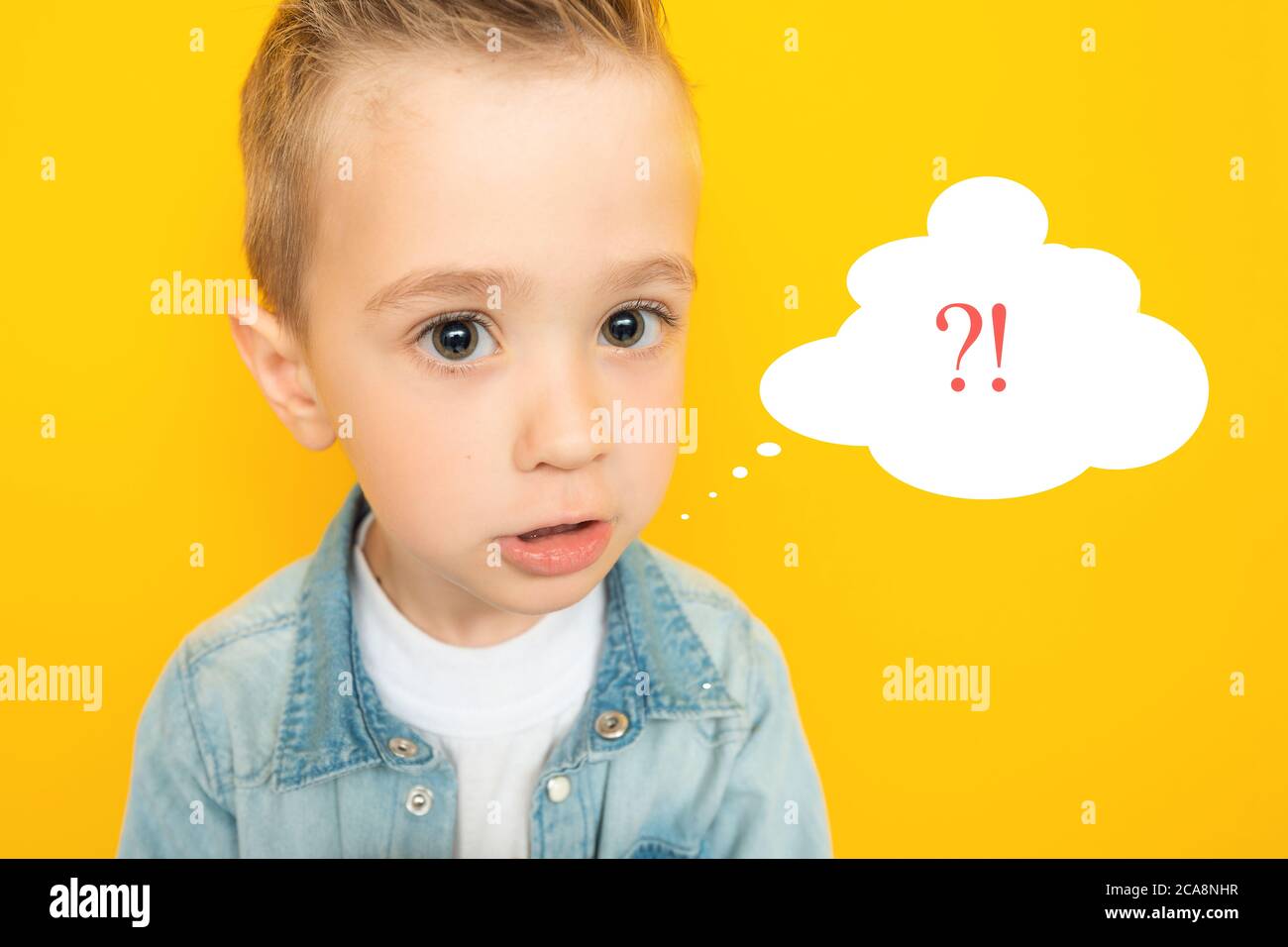Mock up of funny perplexed kid on a yellow background Stock Photo - Alamy