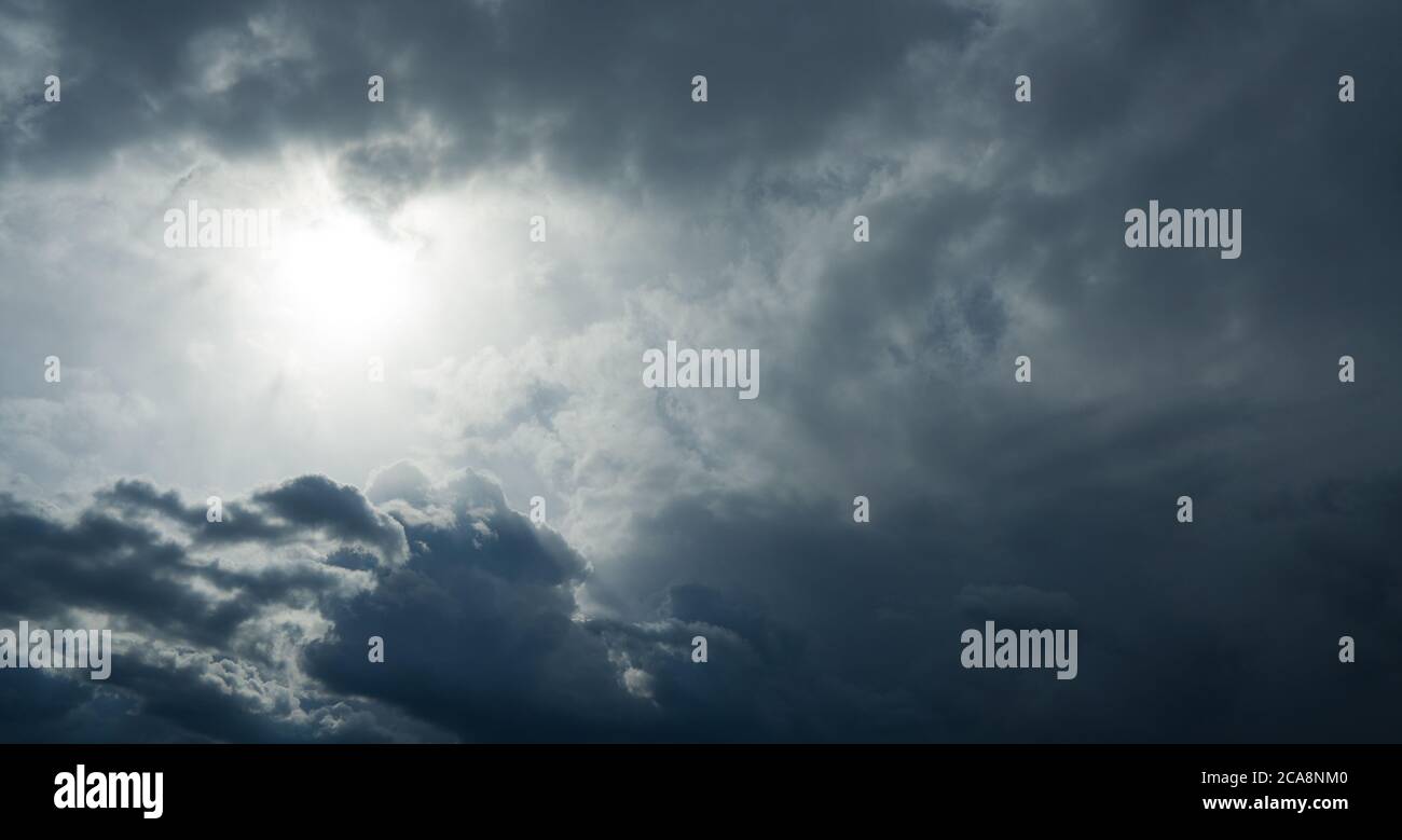 Majestic sky with clouds, sunlight. Beautiful thunder clouds with sun ...