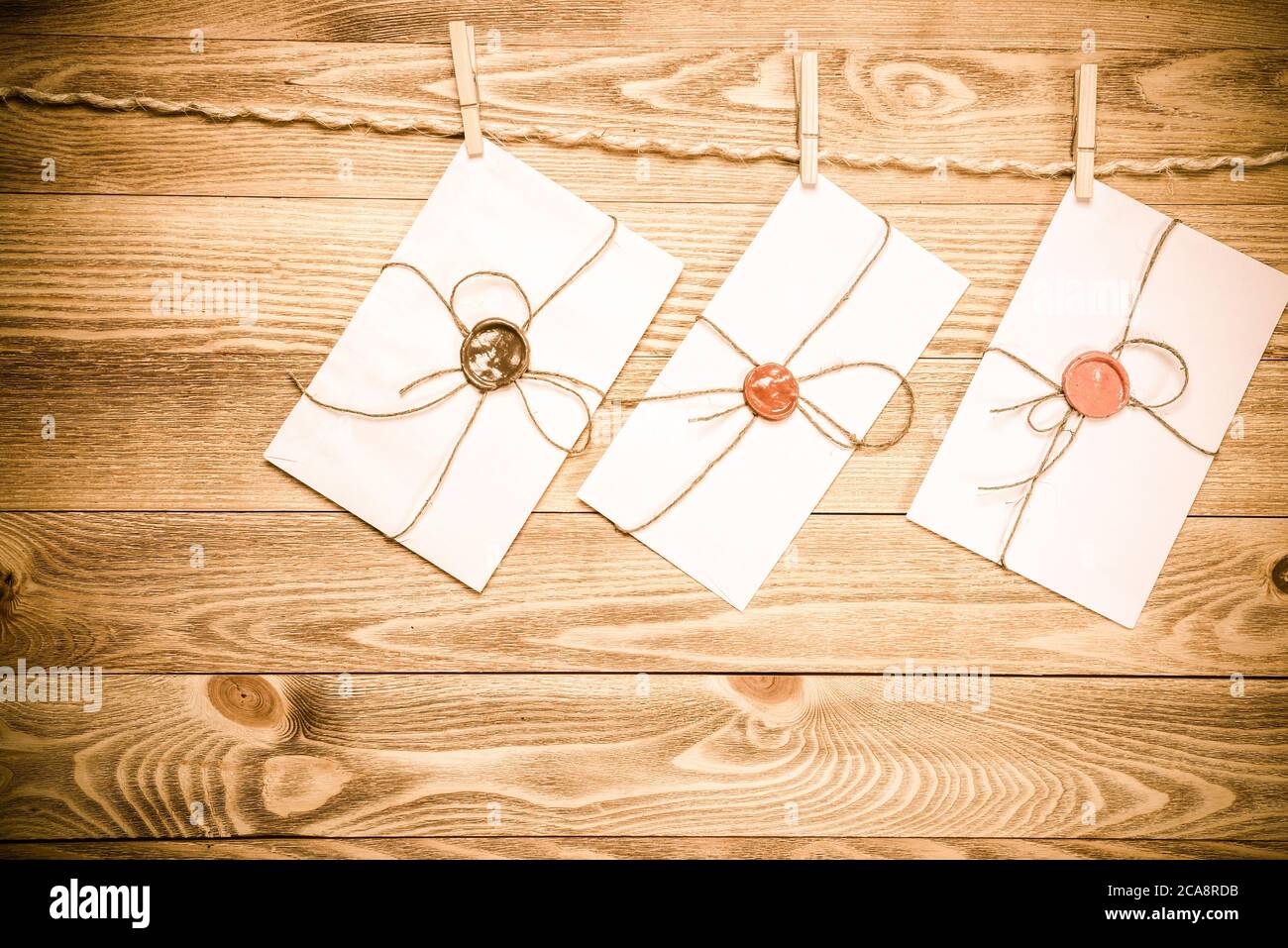 Mail envelope on rope Stock Photo - Alamy