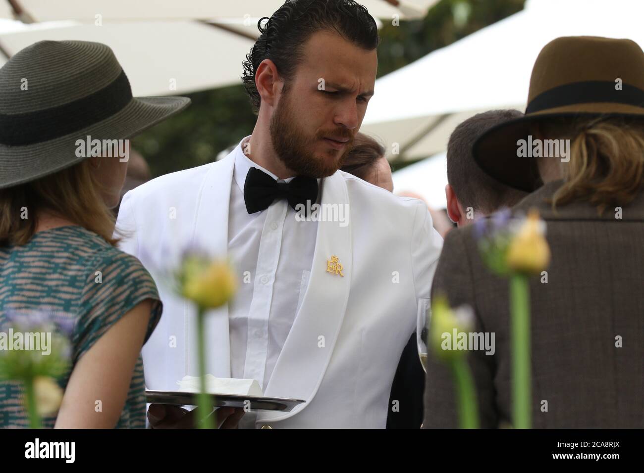 A waiter at the reception at Government House in Sydney, Australia ...