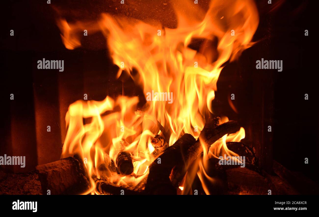 Fire flames in fireplace. Burning wood Stock Photo - Alamy
