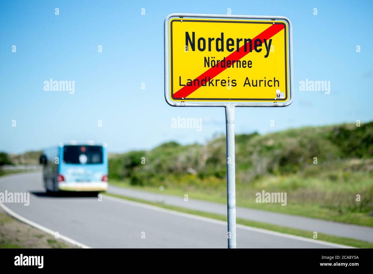 Norderney, Germany. 12th July, 2020. A public bus passes a place-name ...