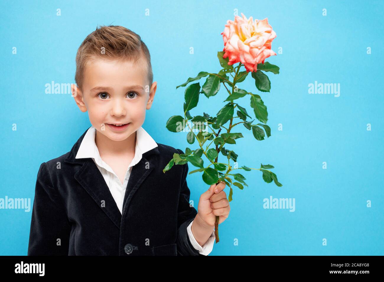 Adorable child holding rose hi-res stock photography and images - Alamy
