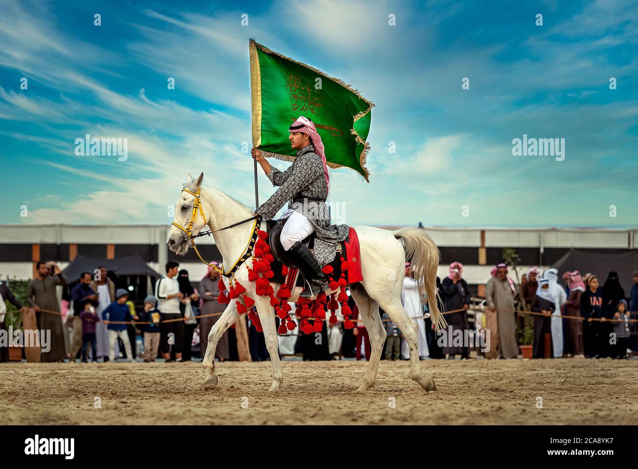 Saudi Arab Horse rider with Saudi Arabia national flag on traditional ...