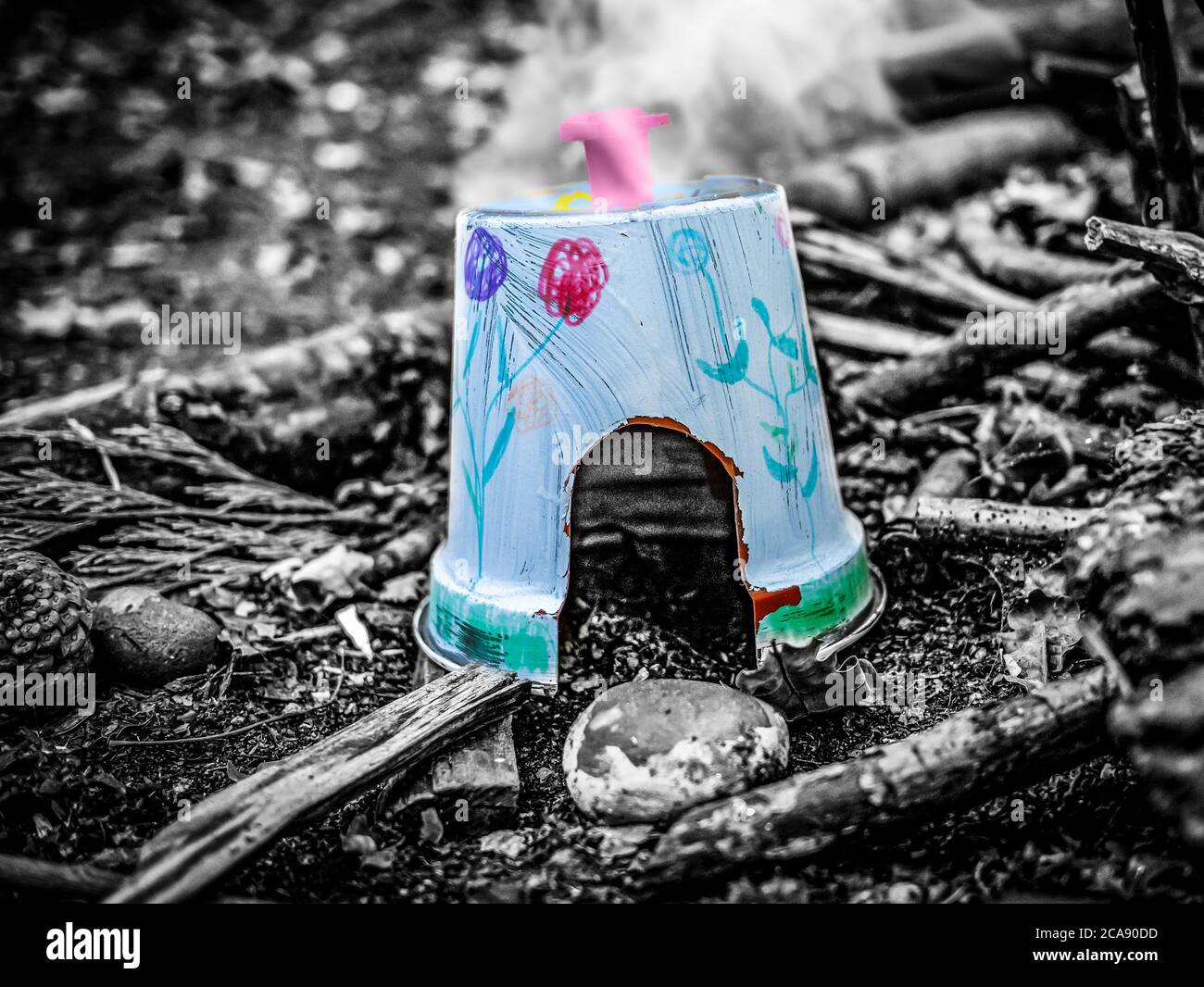 Toy house made out of a bucket, finely decorated, found in the woods ...