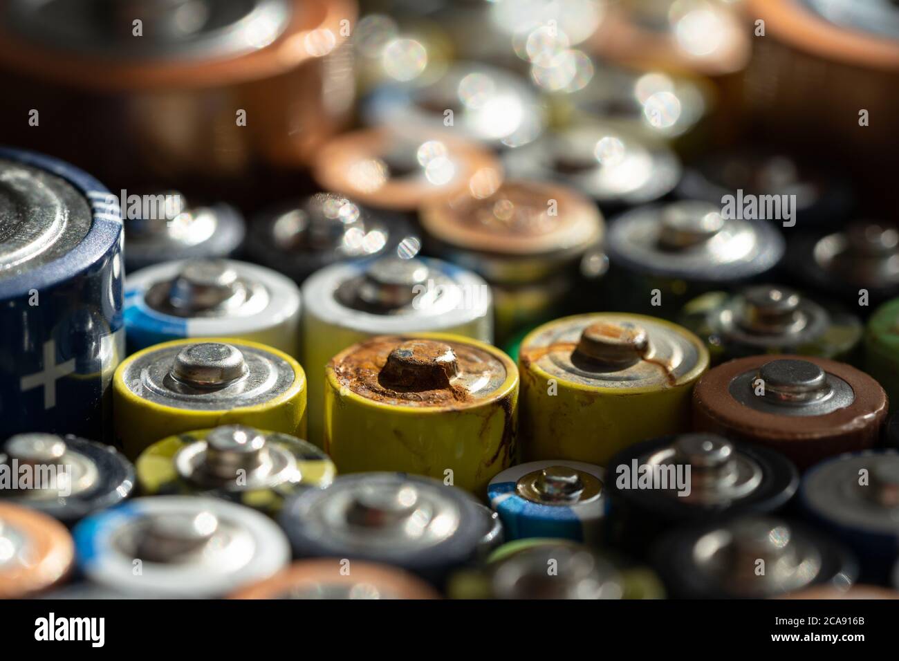 Close up of positive ends of discharged batteries, selective focus ...