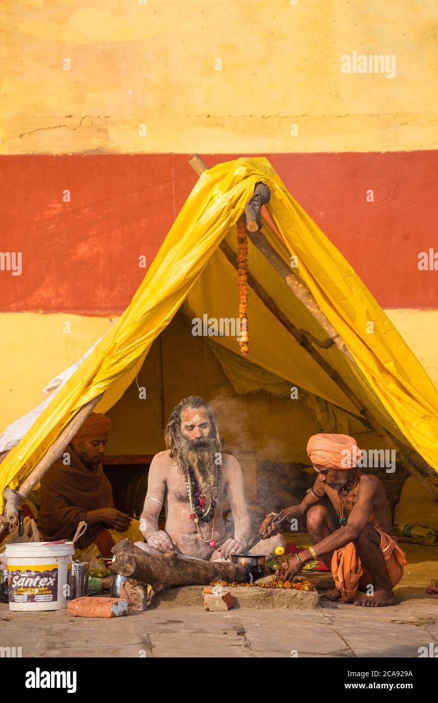 Hindu holy men sitting outside tent, Southern Ghats, Varanasi, Uttar ...