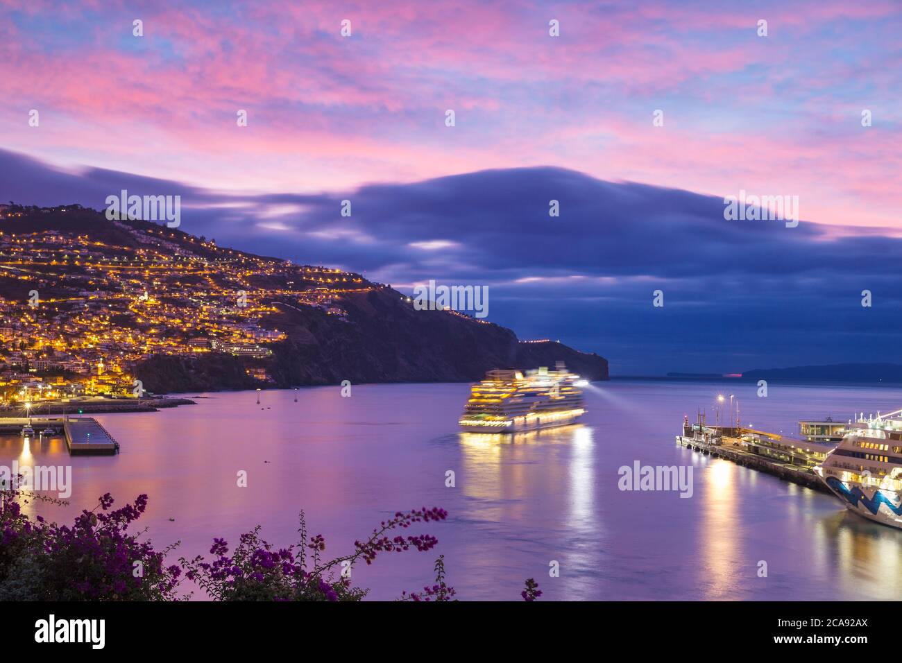 Cruise ship entering Funchal harbour at sunrise, Funchal, Madeira ...