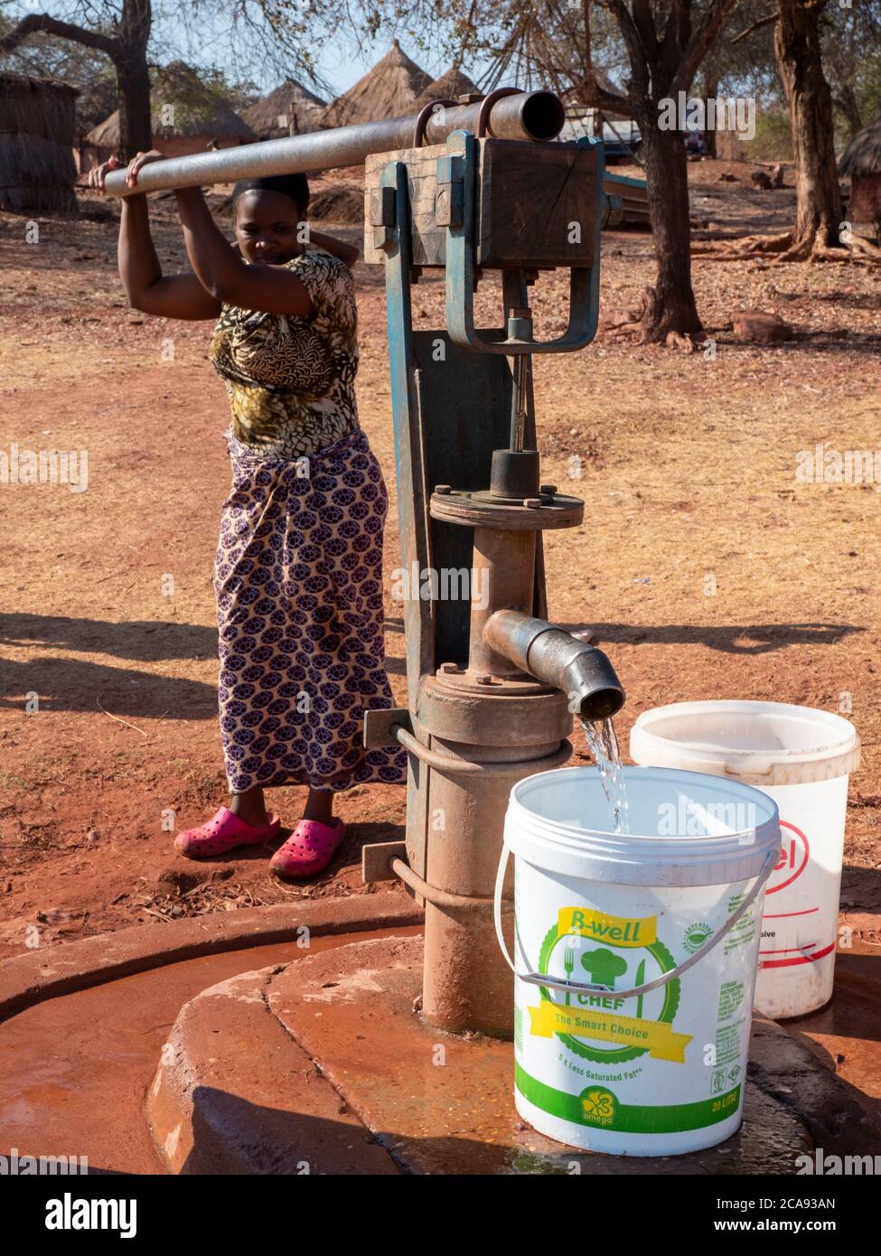 Pumping fresh water,a well in the fishing village of Musamba, on the ...