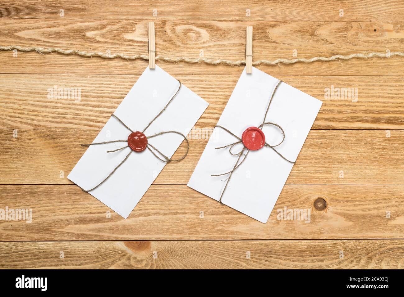 Mail envelope on rope Stock Photo - Alamy