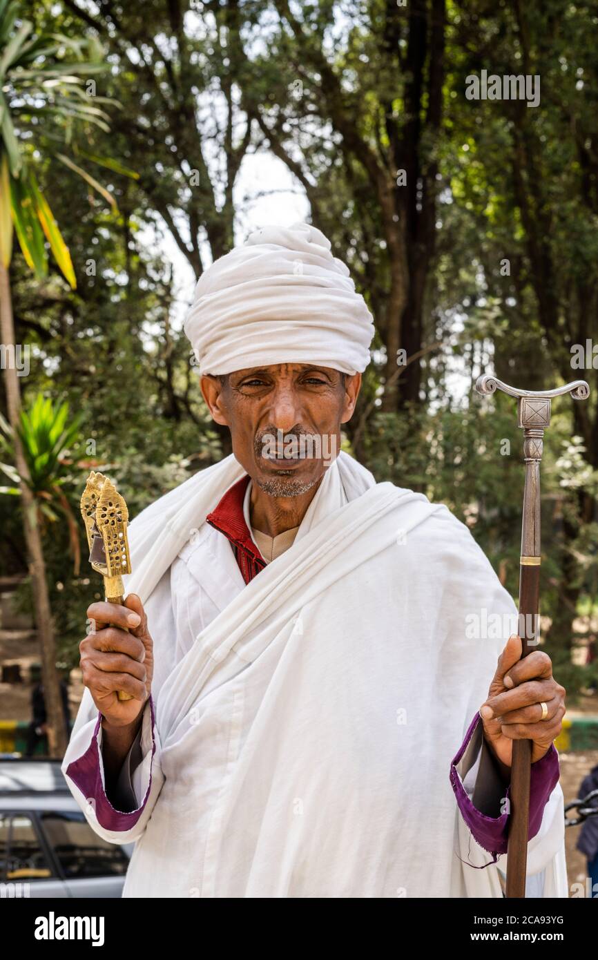 Portrait of Ethiopian Orthodox priest holding the praying stick, Addis ...